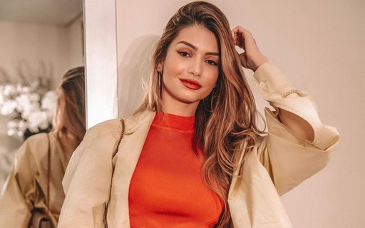 Izabela Cunha posa com look laranja de R$2 mil e arranca suspiros de ...