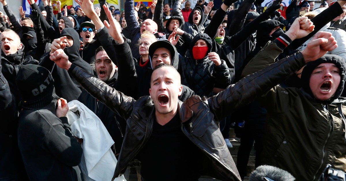 G1 - Protesto contra imigrantes tumultua homenagem às vítimas em ...